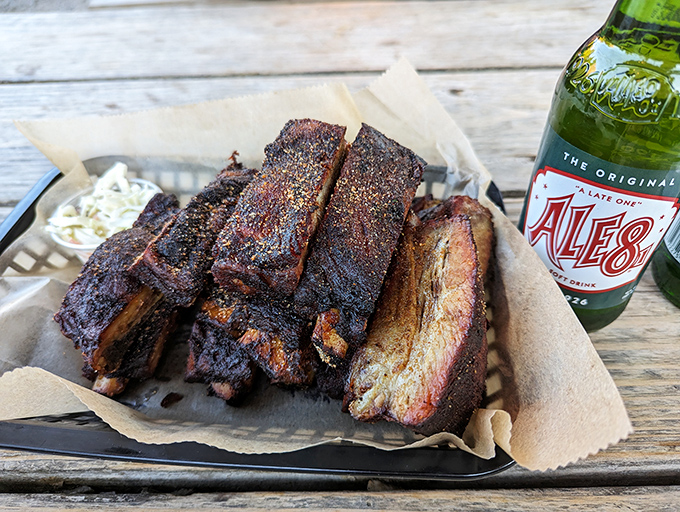 Ribs with the kind of smoke ring that makes barbecue enthusiasts weak in the knees, paired perfectly with an ice-cold Ale-8.