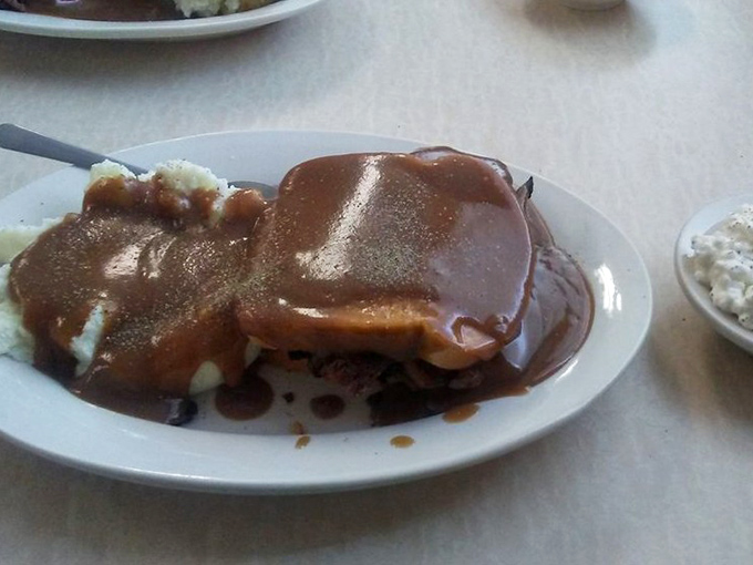 The hot beef sandwich&mdash;where gravy isn't just a topping but a warm, savory lake in which all your worries can dissolve.
