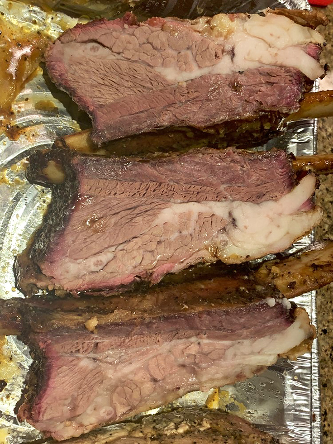 Beef ribs so massive they look like they came from prehistoric cattle. Fred Flintstone would approve of this car-tipping portion size.