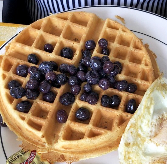 A waffle that's achieved perfect geometry&mdash;crisp exterior, fluffy interior, and blueberries that burst like tiny flavor bombs with each forkful.