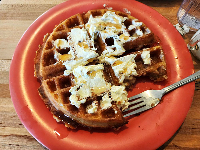 A Belgian waffle that's achieved the impossible dream: crispy exterior, fluffy interior, and butter melting into every perfect square. Maple syrup's best friend.