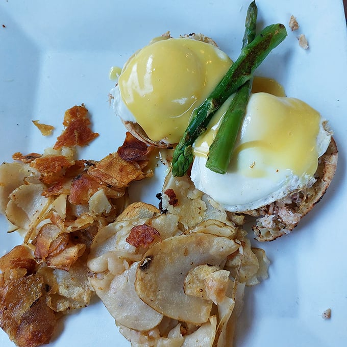 Eggs Benedict with asparagus spears standing at attention &ndash; this breakfast knows it's royalty on a plate.