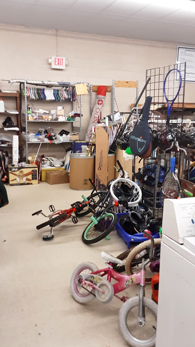 Bicycle heaven! Kids' bikes wait patiently for new adventures, while tennis rackets dream of their next match point.