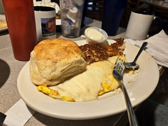 That biscuit isn't just tall&mdash;it's downright architectural. The kind of carb that makes you question every diet you've ever attempted.