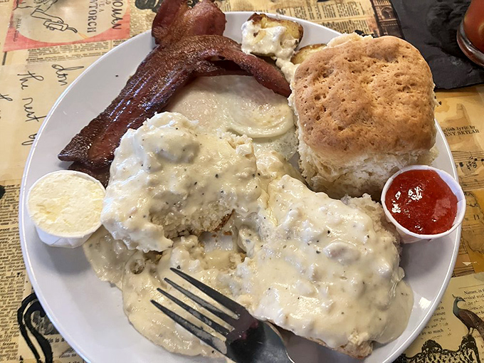 These biscuits and gravy have achieved what politicians can't—bringing perfect harmony between flaky, buttery heights and savory, peppery depths.
