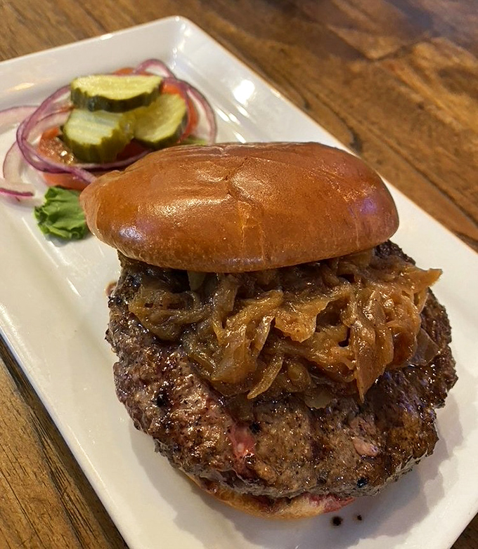 This bison burger topped with caramelized onions isn't just dinner&mdash;it's proof that sometimes the road less traveled tastes significantly better.