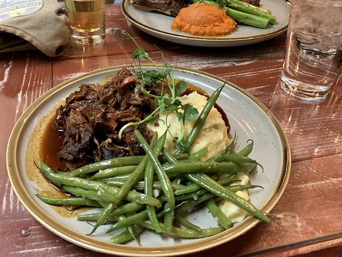Bison pot roast so tender it practically melts, accompanied by vegetables that know their supporting role perfectly.