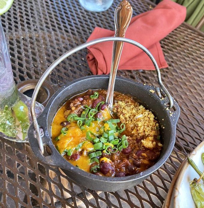 Bison chili served in a mini cast-iron pot&mdash;because regular bowls just can't handle this much flavor. Topped with cheese that melts like Arizona sunshine.