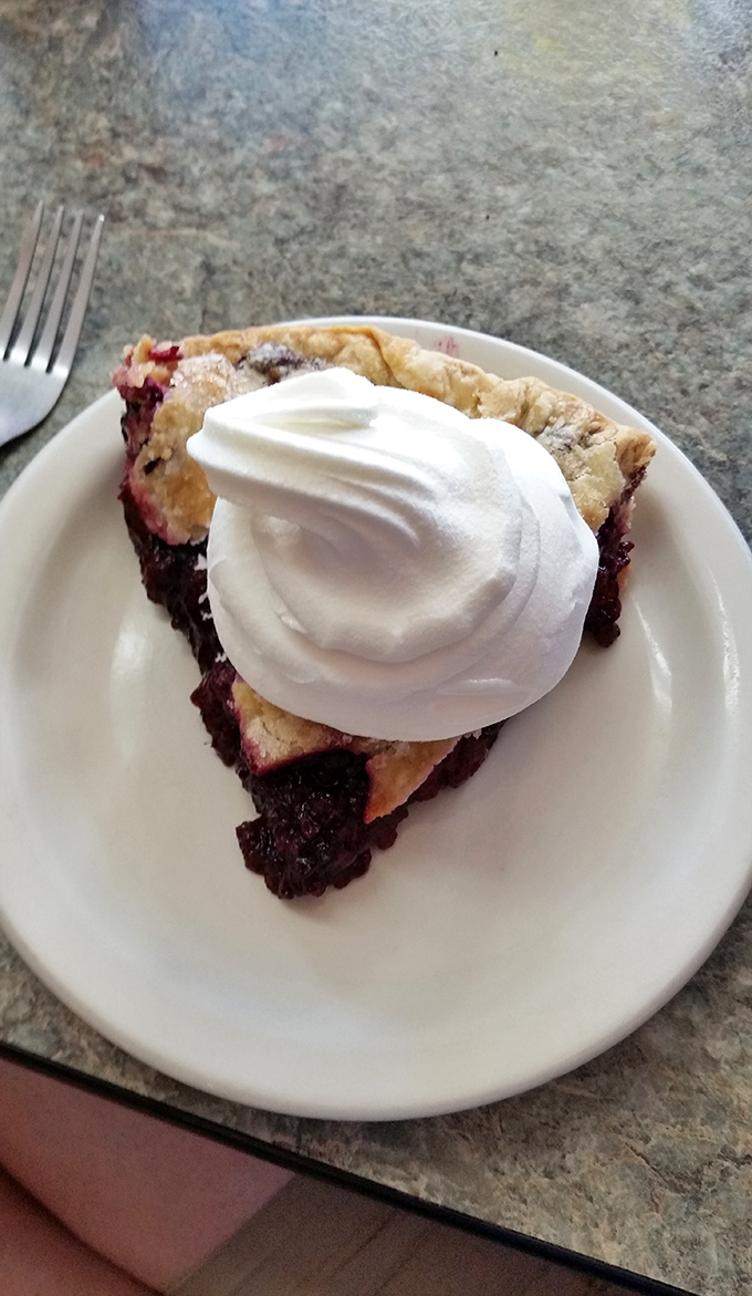 This blackberry pie topped with a cloud of whipped cream isn't just dessert &ndash; it's the reason elastic waistbands were invented.