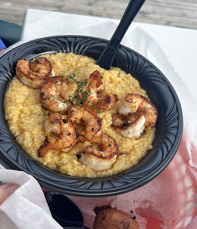 Blackened shrimp nestled on creamy grits – a Southern classic that proves some relationships are simply meant to be.