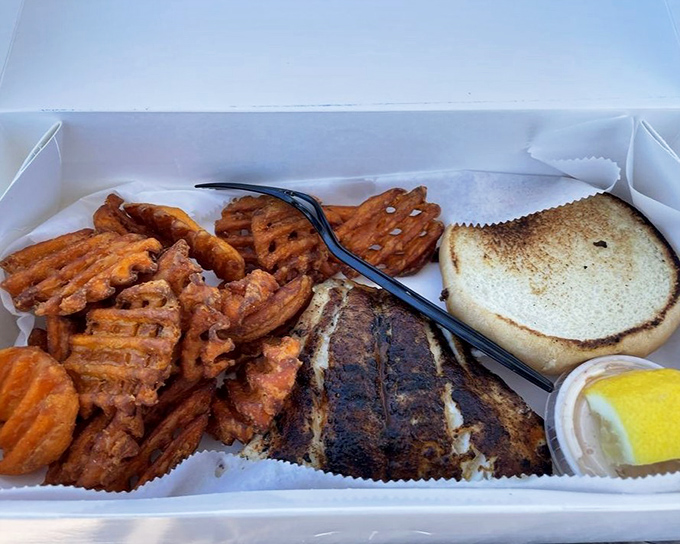The blackened grouper sandwich: Florida's answer to the Philly cheesesteak. A masterpiece of simplicity with sweet potato waffle fries.