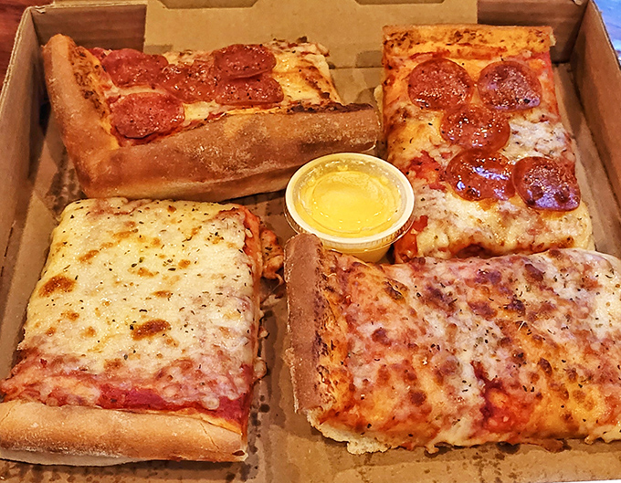 Four distinct quadrants of pepperoni bliss, each one a testament to the art of pizza-making.