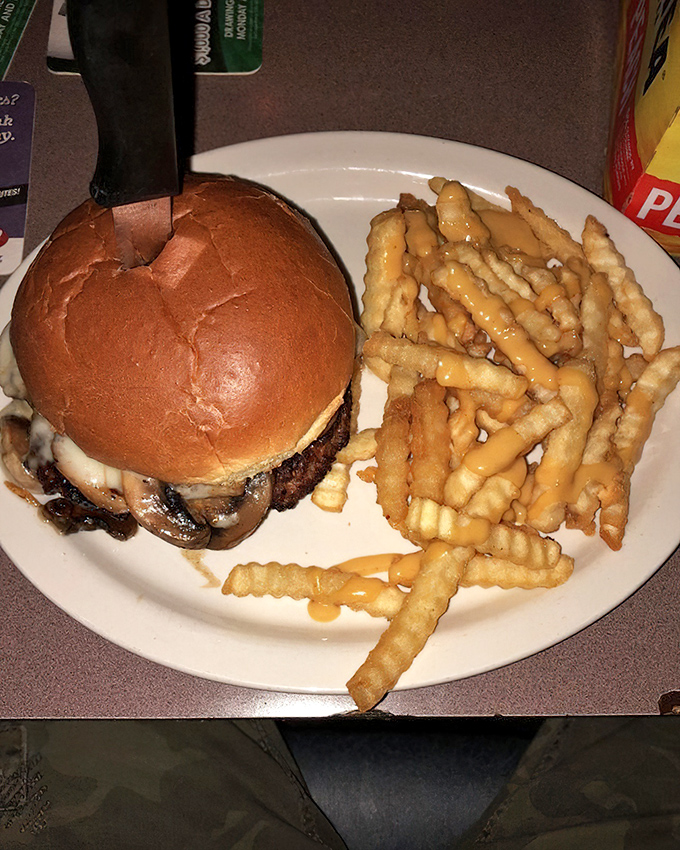 A burger that demands a two-handed commitment and possibly signing a prenup. Those mushrooms aren't just along for the ride.