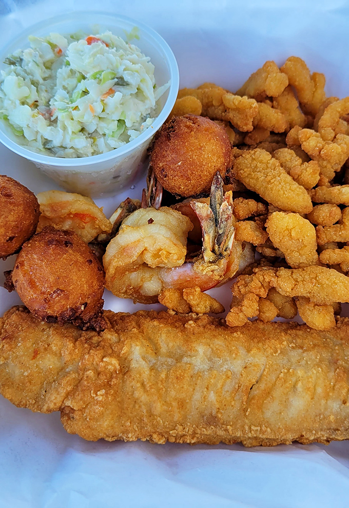 A seafood medley that sings in perfect harmony&mdash;crispy clam strips, succulent shrimp, and golden hush puppies performing alongside the coleslaw's refreshing encore.