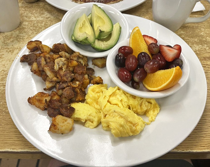 Breakfast perfection: crispy potatoes, fluffy eggs, fresh fruit. The kind of morning fuel that makes you wonder why you ever settled for cereal.