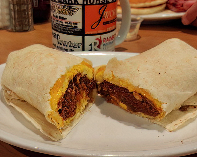 The legendary breakfast burrito, cut to reveal its treasure trove of fillings&mdash;like a delicious archaeological dig revealing ancient secrets of flavor.