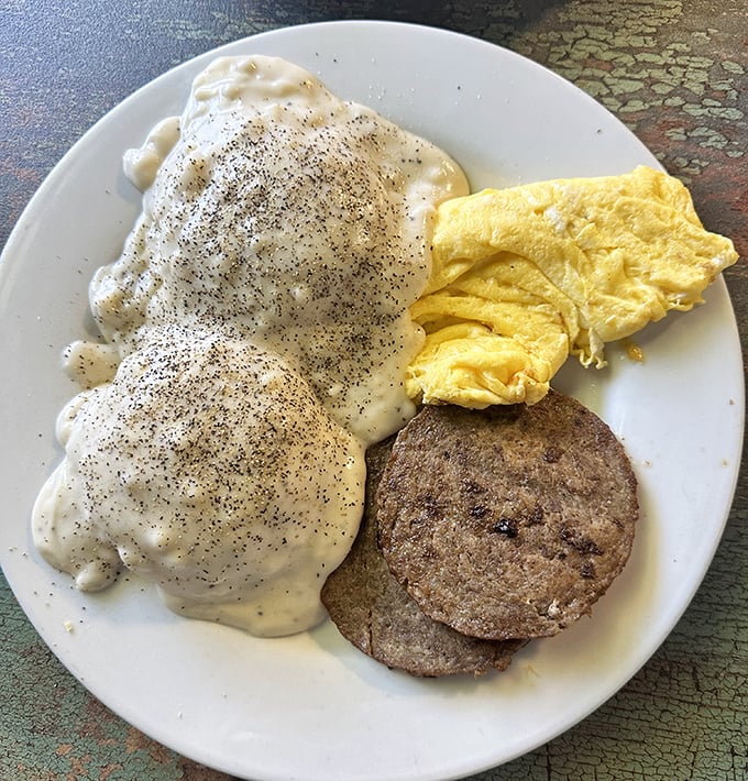 Biscuits smothered in gravy alongside perfectly scrambled eggs and sausage&mdash;the breakfast trinity that's converted more diet plans than Sunday sermons.