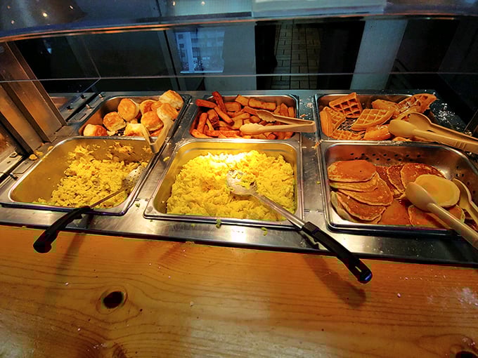 The breakfast buffet spread&mdash;where pancakes, eggs, and breakfast meats wait patiently for your plate, like a morning version of heaven's gates.