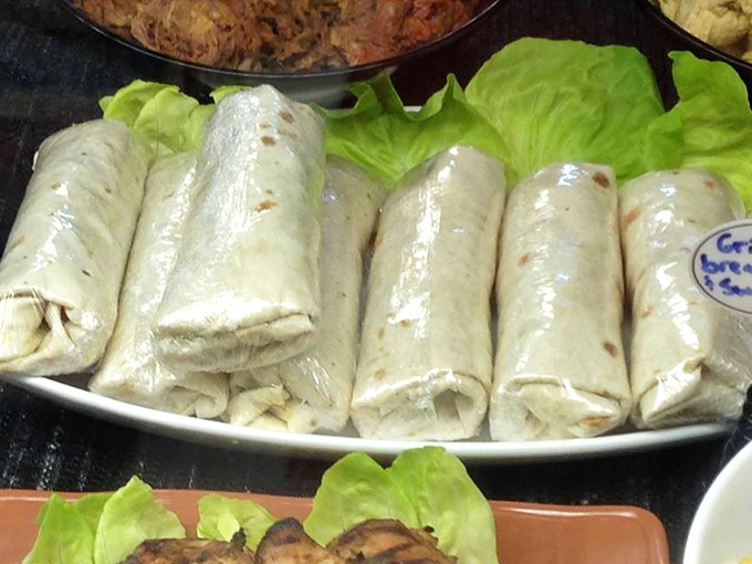 Breakfast burritos lined up like delicious soldiers, ready to battle your hunger with their perfect blend of morning goodness.