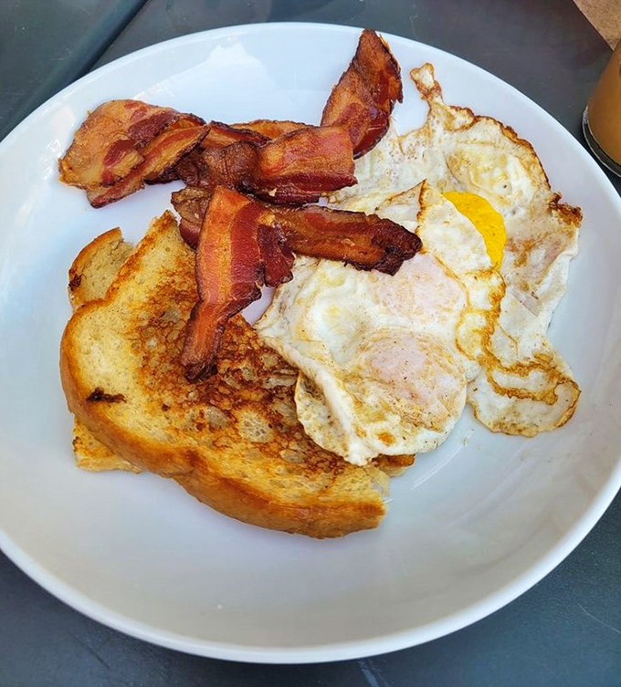 The holy trinity of breakfast: golden toast, perfectly cooked eggs, and bacon that's achieved that magical state between chewy and crisp. Hallelujah!