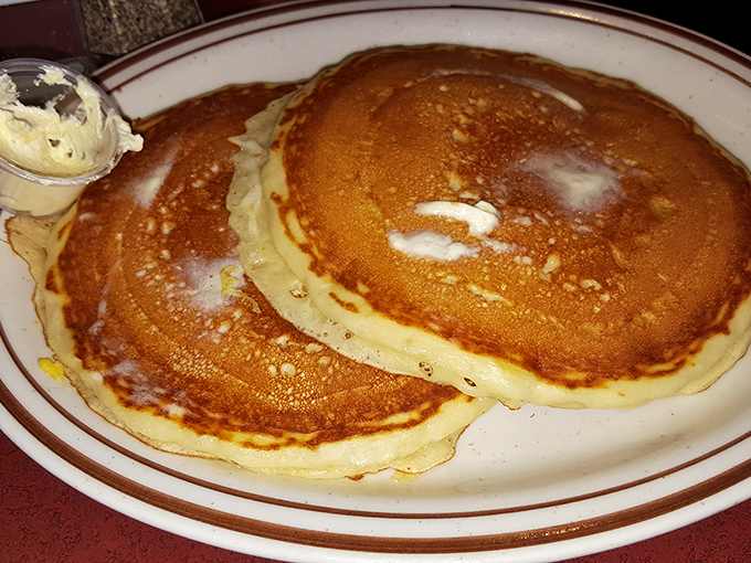 Pancakes so perfectly golden they make you wonder if the griddle has been seasoned with decades of breakfast magic.
