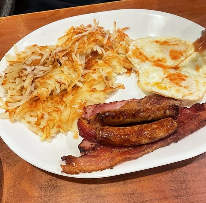 The holy trinity of breakfast: perfectly crispy hash browns, eggs with just-right yolks, and breakfast meats that had a higher purpose.