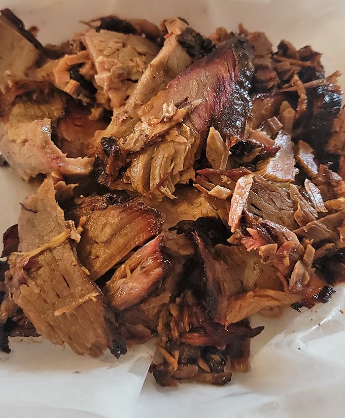Brisket that doesn't need sauce is the mark of a true pitmaster. These slices, with their glistening fat and pink smoke ring, tell the whole story.