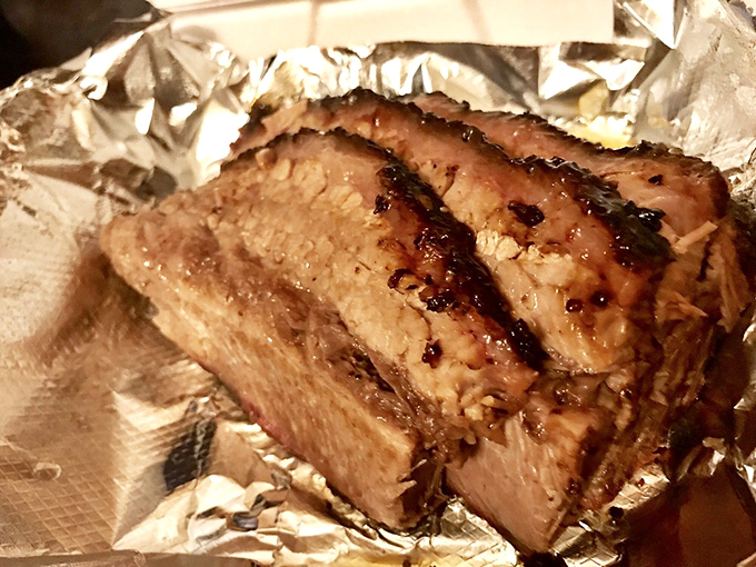 Brisket with that telltale pink smoke ring that separates the professionals from the weekend warriors. Meat candy for grown-ups.