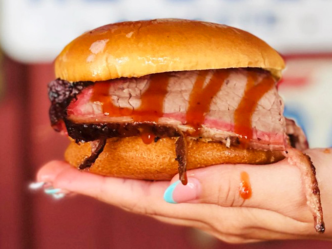 Behold the brisket sandwich&mdash;where smoke-kissed beef meets pillowy bun in a romance novel of flavor. That pink smoke ring is the BBQ equivalent of a Michelin star.