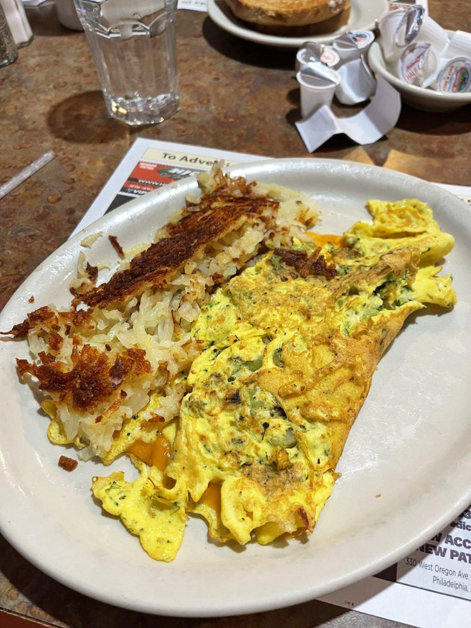 An omelet that doesn't just contain vegetables&mdash;it celebrates them in a fluffy yellow embrace of cheesy perfection.