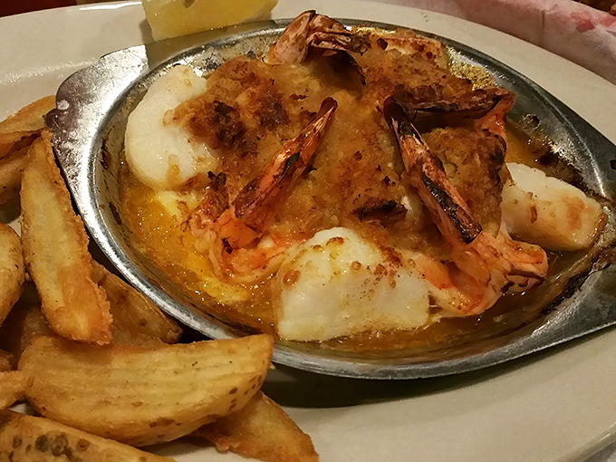 Scallops bathing in butter with shrimp companions. Like a seafood hot tub party where everyone's invited&mdash;especially your taste buds.