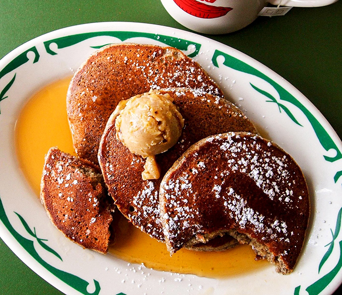 Buckwheat banana pancakes swimming in maple syrup with a melting pat of butter. Breakfast doesn't get more comforting than this little stack of joy.