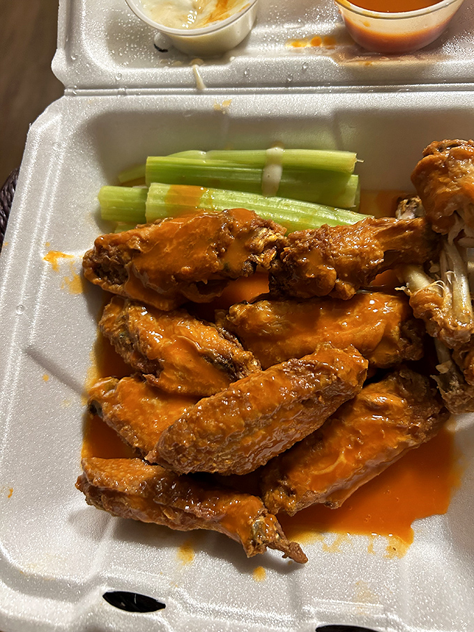 Buffalo wings that don't mess around&mdash;crispy, saucy, and served with the obligatory celery sticks for that token vegetable appearance.
