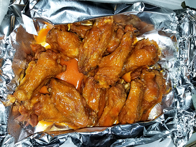 These buffalo wings aren't messing around&mdash;glistening with sauce and promising the kind of flavor that makes napkins necessary and regrets impossible.