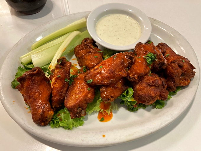Buffalo wings that arrive like tiny orange messengers of spicy, saucy salvation for your taste buds.