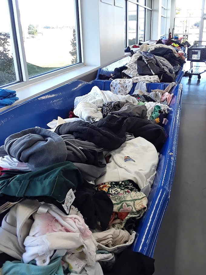 Textile archaeology at its finest. Somewhere in this fabric mountain lurks the perfect sweater, waiting for its second chance at fashion glory.