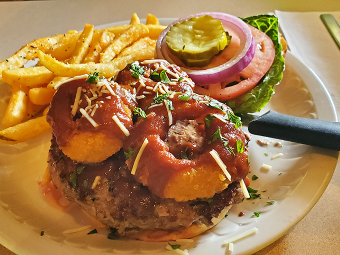 This isn't just a burger&mdash;it's an architectural marvel with onion rings that deserve their own zip code.
