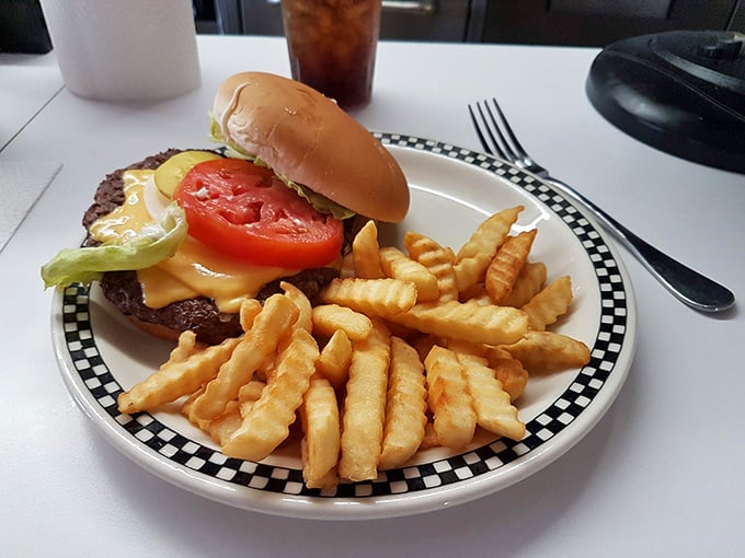 The burger arrives like a juicy work of art&mdash;melted cheese, fresh veggies, and a patty that makes plant-based alternatives weep with inadequacy.