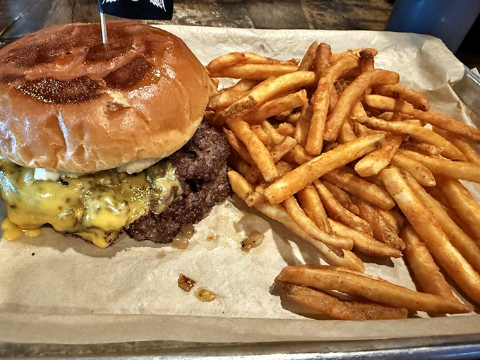 Even the burger gets the royal treatment&mdash;a juicy patty crowned with melted cheese alongside golden fries that demand to be devoured immediately.