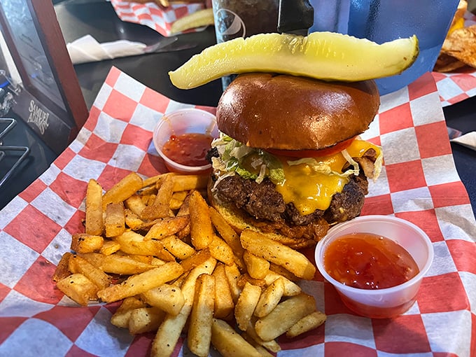 A burger that requires jaw exercises beforehand, complete with a pickle spear standing tall like a victory flag. This isn't fast food&mdash;it's slow, deliberate pleasure.