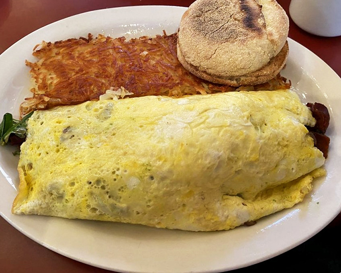 This isn't just an omelet&mdash;it's a golden-hued sleeping bag for delicious fillings, accompanied by a hash brown crispy enough to make a potato proud.