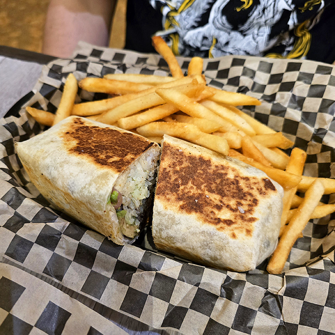 A perfectly grilled burrito that's been kissed by the griddle gods, creating that ideal crispy-to-soft texture ratio.