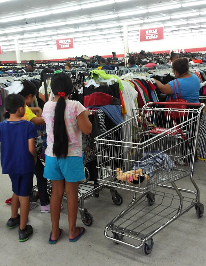 Families hunt together through the racks, passing down the ancient art of thrift store patience to the next generation.