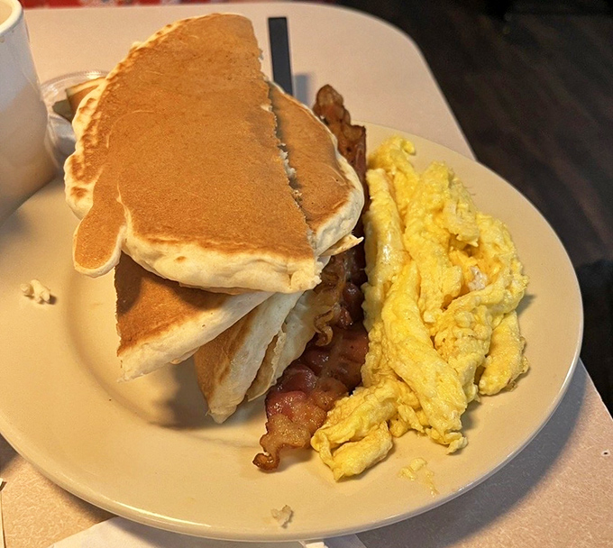 Pancakes so fluffy they could double as pillows, with bacon and eggs that remind you why breakfast deserves its "most important meal" status.