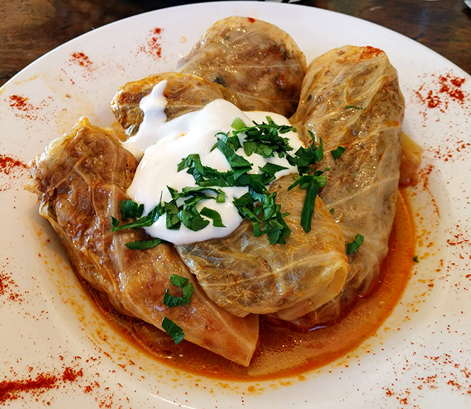 Cabbage rolls that could make your Ukrainian grandmother weep with joy. Wrapped with precision and swimming in a sauce worth bottling.
