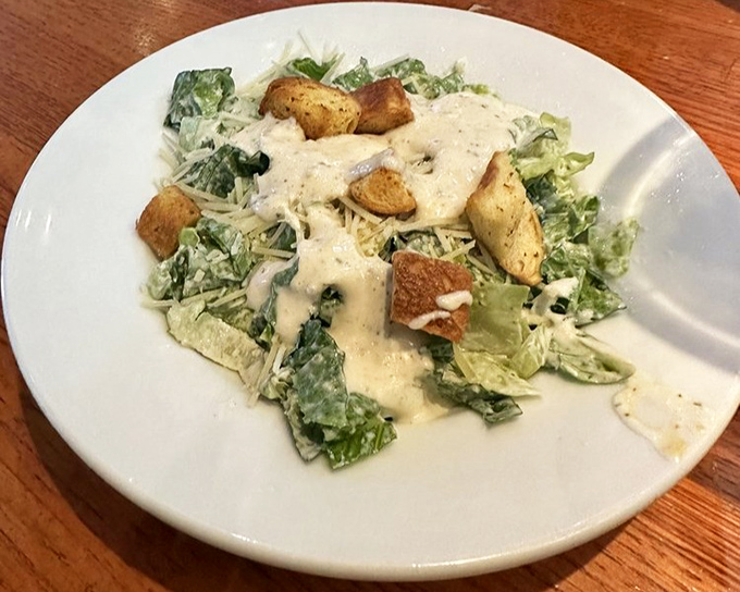 Caesar salad: the Switzerland of menu items. Neutral enough for everyone, yet secretly complex with its creamy dressing and perfectly toasted croutons.