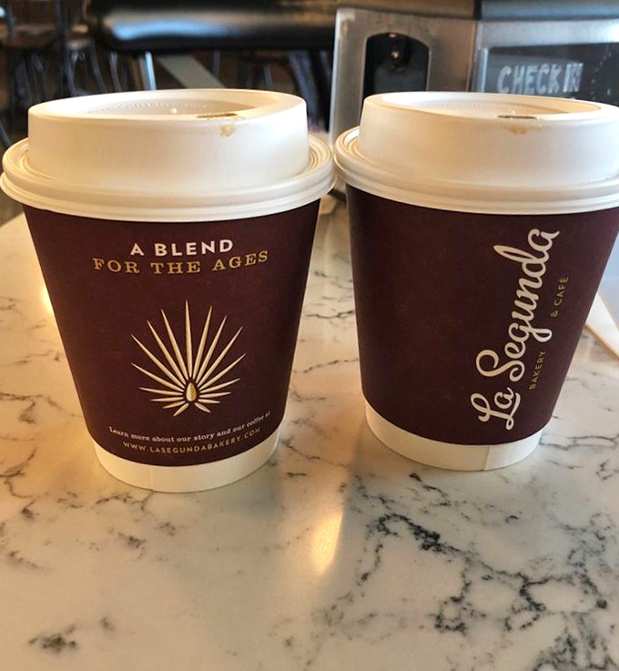 Two cups of café con leche sitting pretty on marble—the breakfast of champions and the afternoon pick-me-up that makes Florida run on Cuban time.