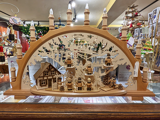This intricate wooden candle arch&mdash;or Schwibbogen&mdash;tells a complete winter story through delicate cutouts and miniature figurines.