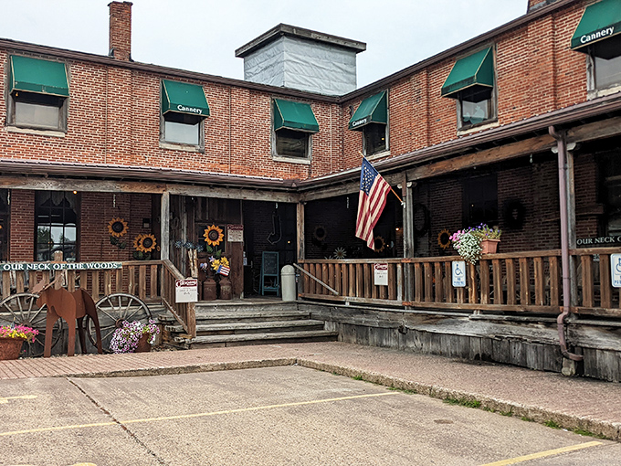 The Cannery's rustic wooden porch welcomes visitors with sunflowers and Americana charm&mdash;the kind of place where rocking chairs deserve their own names.