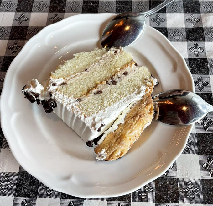 A slice of cannoli cake that would make even the Godfather put down his gun. Cream so light it practically floats above the plate.